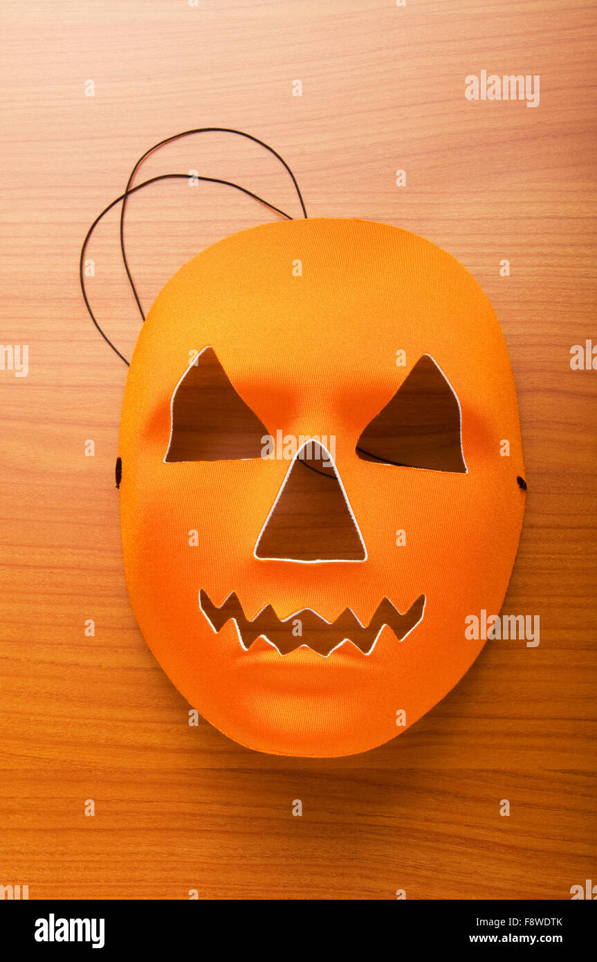 Orange scary halloween mask as holiday concept Stock Photo - Alamy
