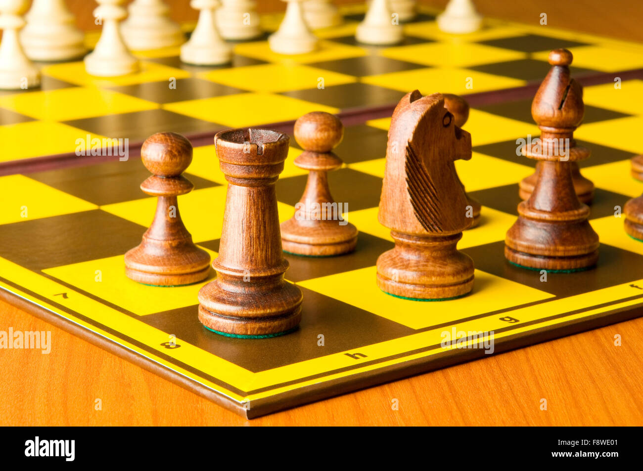 Set of chess figures on the playing board Stock Photo - Alamy