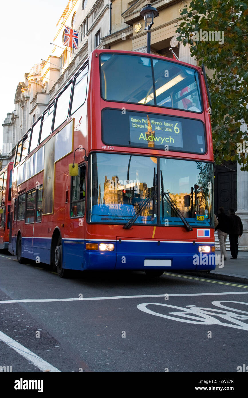 Modern London double-decker bus with Trafalgar square reflecting in the ...
