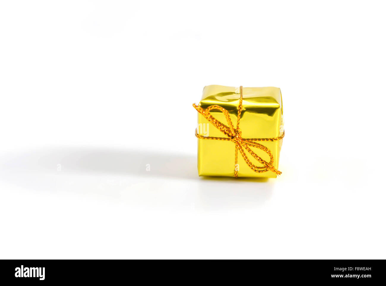 yellow color gift box on white background Stock Photo - Alamy