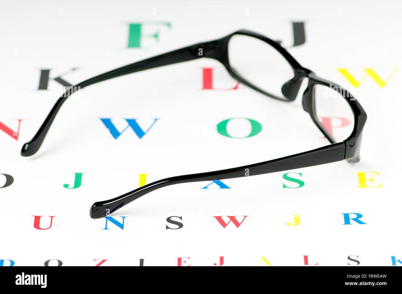 Optical reading glasses on the eyesight table Stock Photo - Alamy