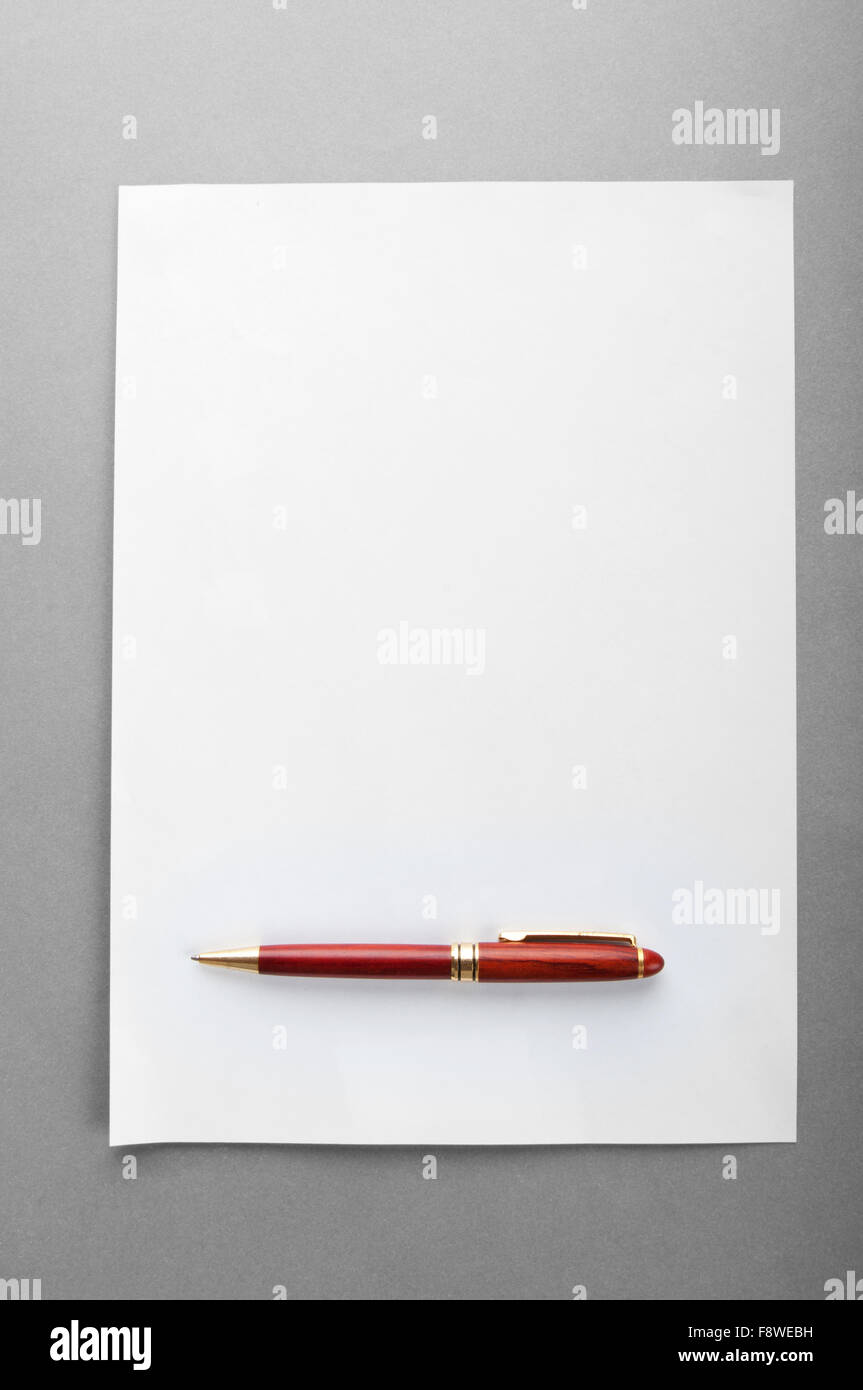 Pen on the sheet of paper Stock Photo - Alamy