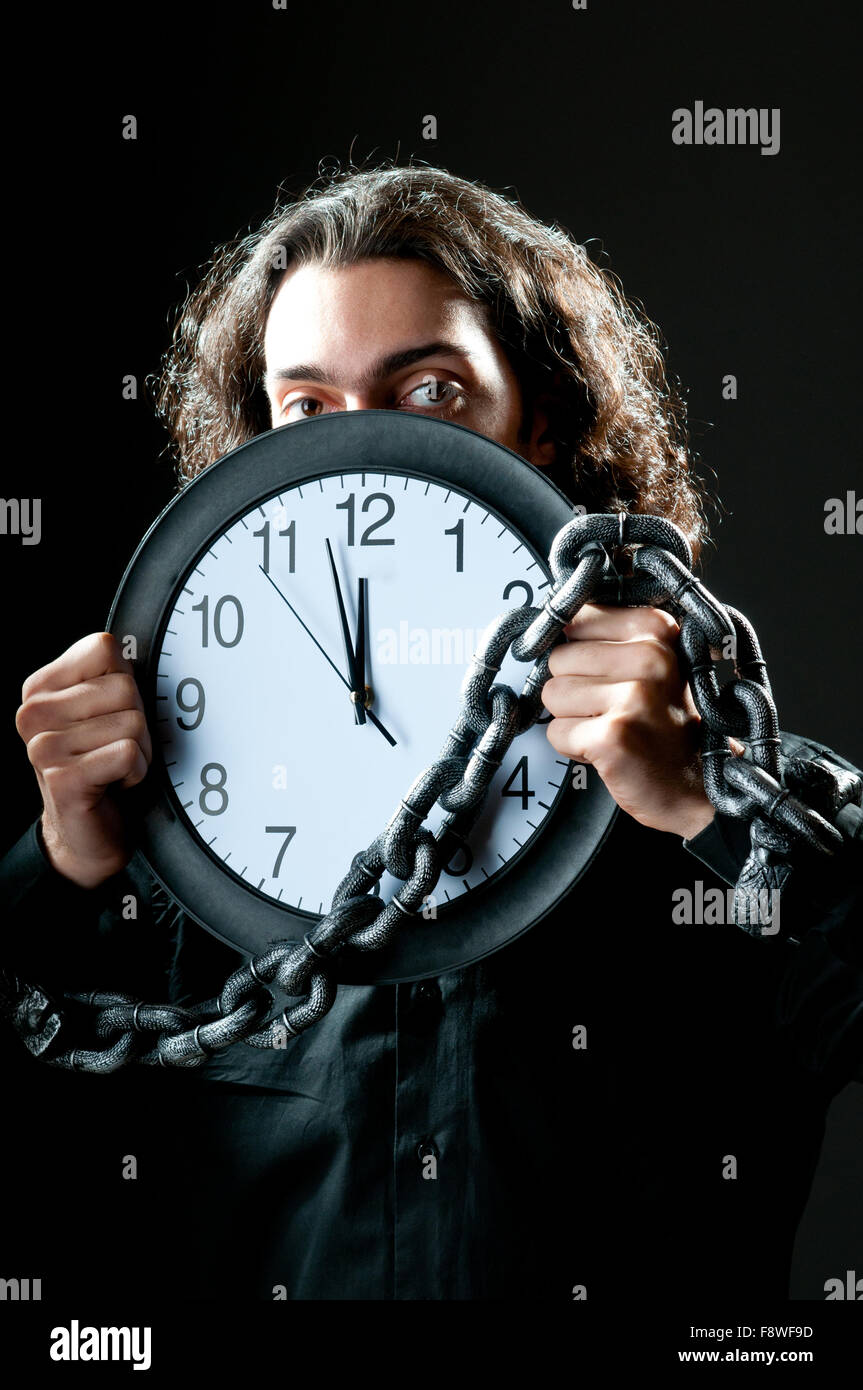 Man chained to the clock Stock Photo - Alamy