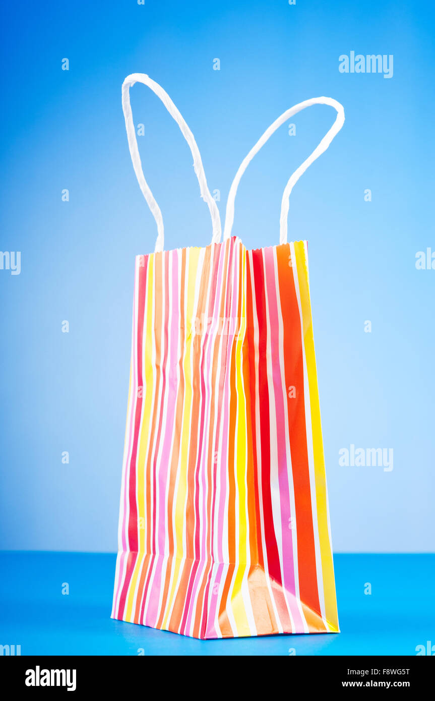 Colourful paper shopping bags against gradient background Stock Photo ...