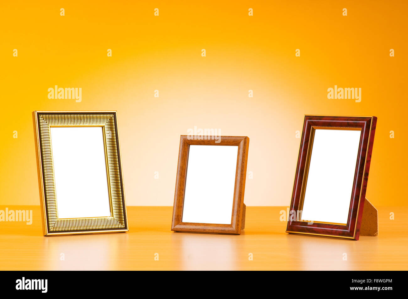 Wooden picture frames on the gradient background Stock Photo - Alamy