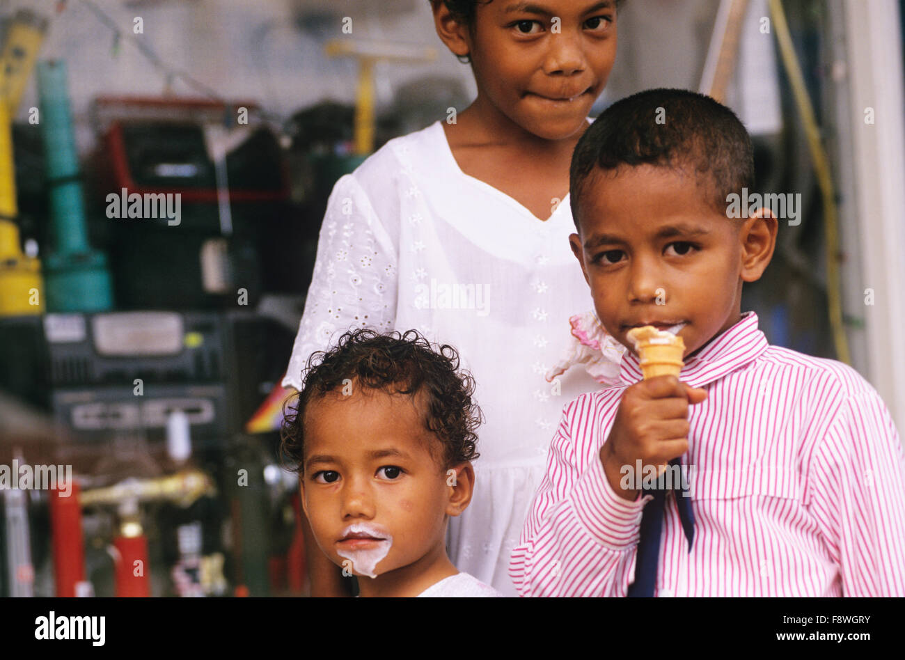 Fiji Islands, Vanua Levu, Labasa Town, children sharing an ice cream ...