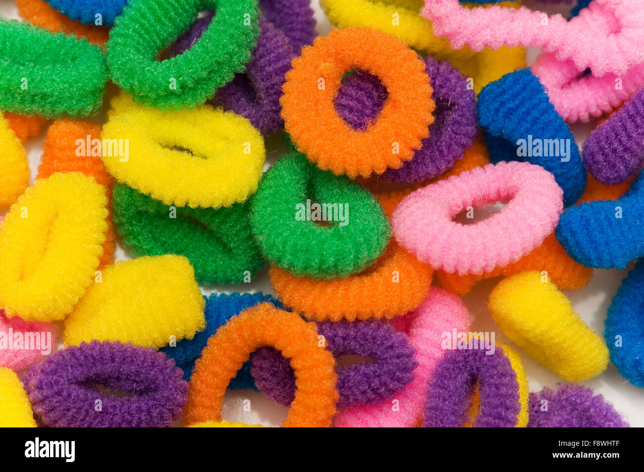 Rubber bands of the various bright colurs Stock Photo - Alamy