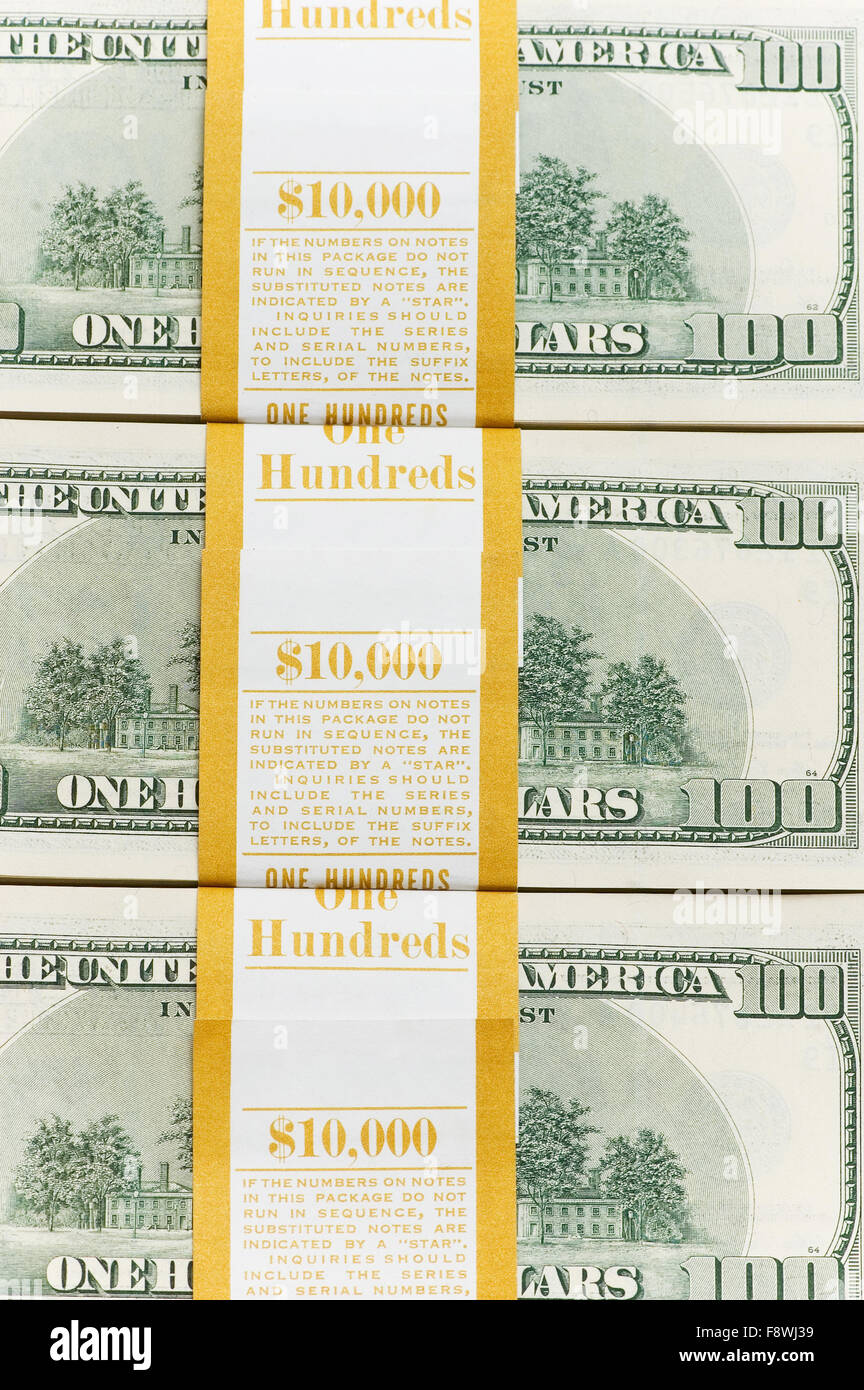 Ten thousand dollar stacks on the white Stock Photo - Alamy