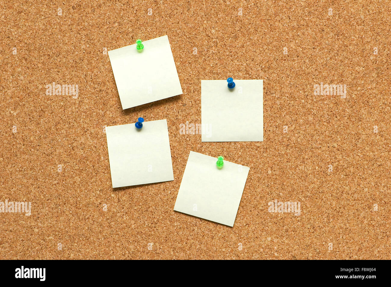 Yellow post it notes on the corkboard Stock Photo - Alamy