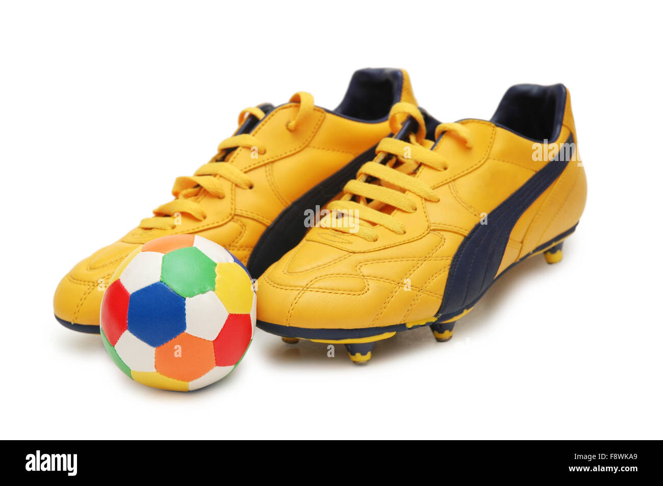 Yellow soccer footwear and color football isolated on white Stock Photo ...