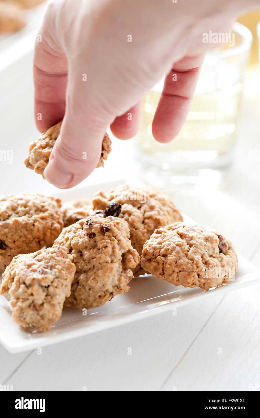 Taking a cookie Stock Photo - Alamy