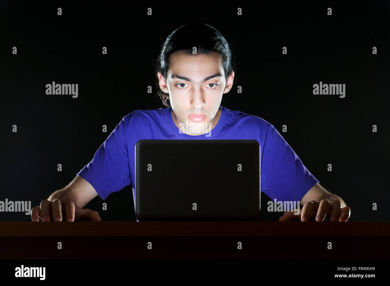 Hacker in white mask typing hi-res stock photography and images - Alamy