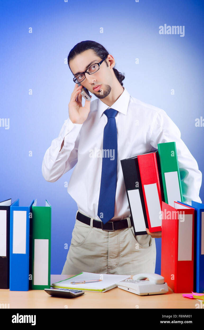 Businessman with many office folders Stock Photo - Alamy