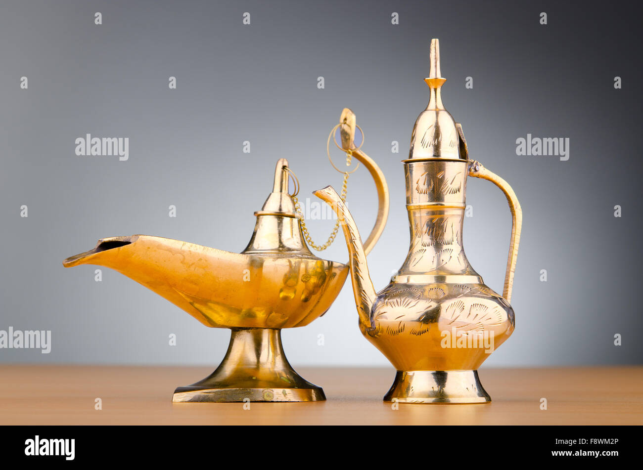 Ancient lamp against gradient background Stock Photo - Alamy