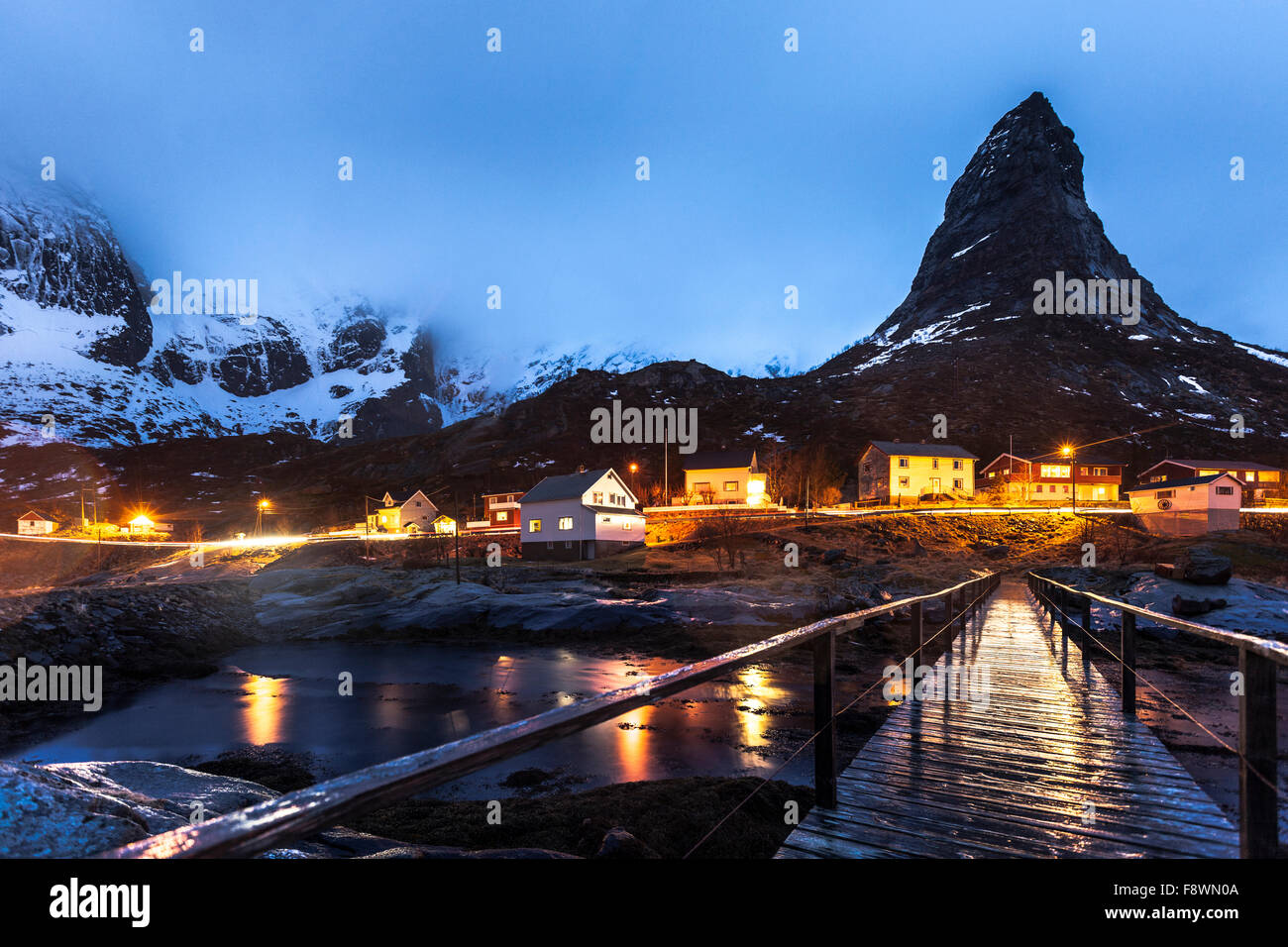Dock with mountain in winter, the fishing village of Reine, Reine Fjord ...