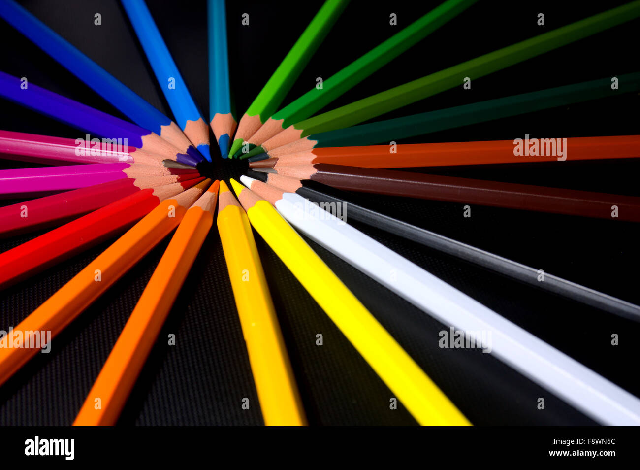 Brightly colored pencil crayons from the red side of the colour ...