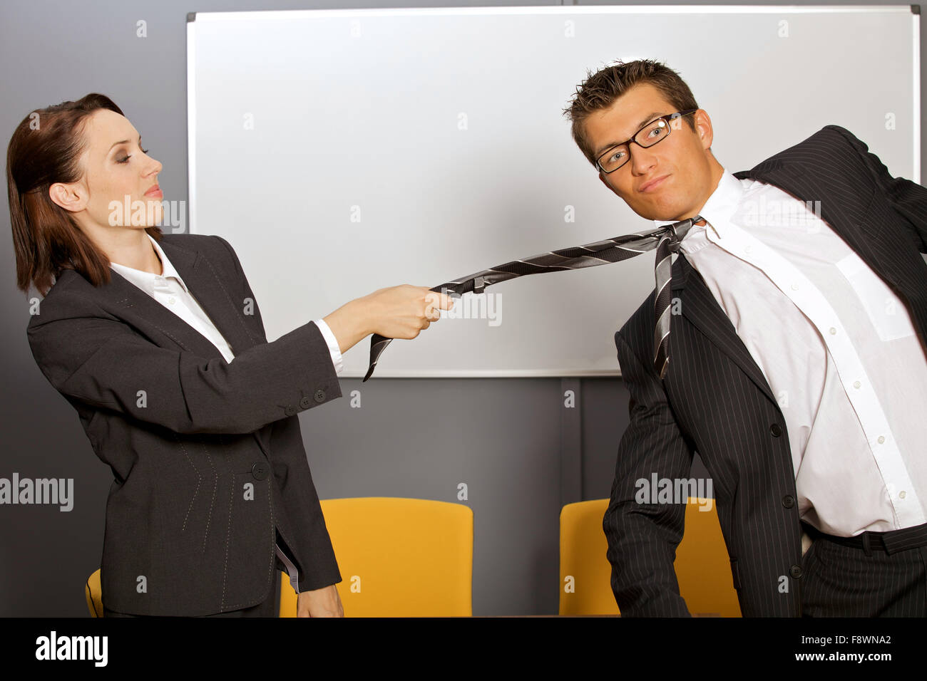 Man chair woman pulling hi-res stock photography and images - Alamy