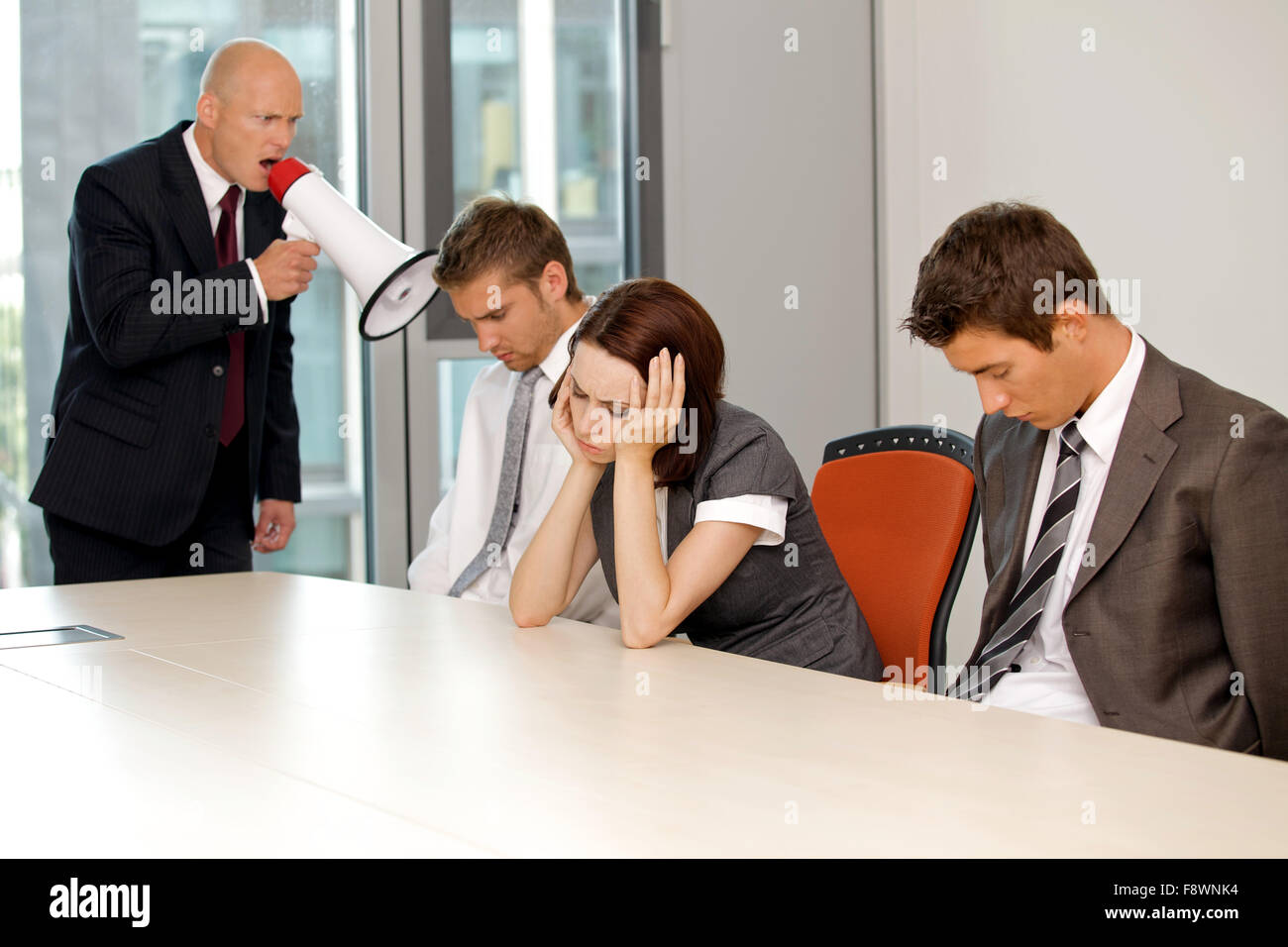 Young confident caucasian businessman screaming on his employee Stock ...