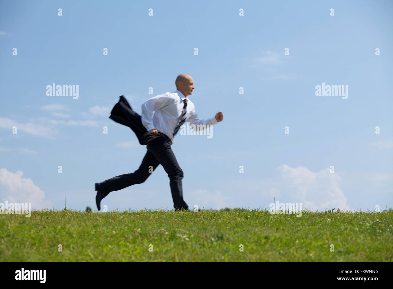 Man in suit running away hi-res stock photography and images - Alamy