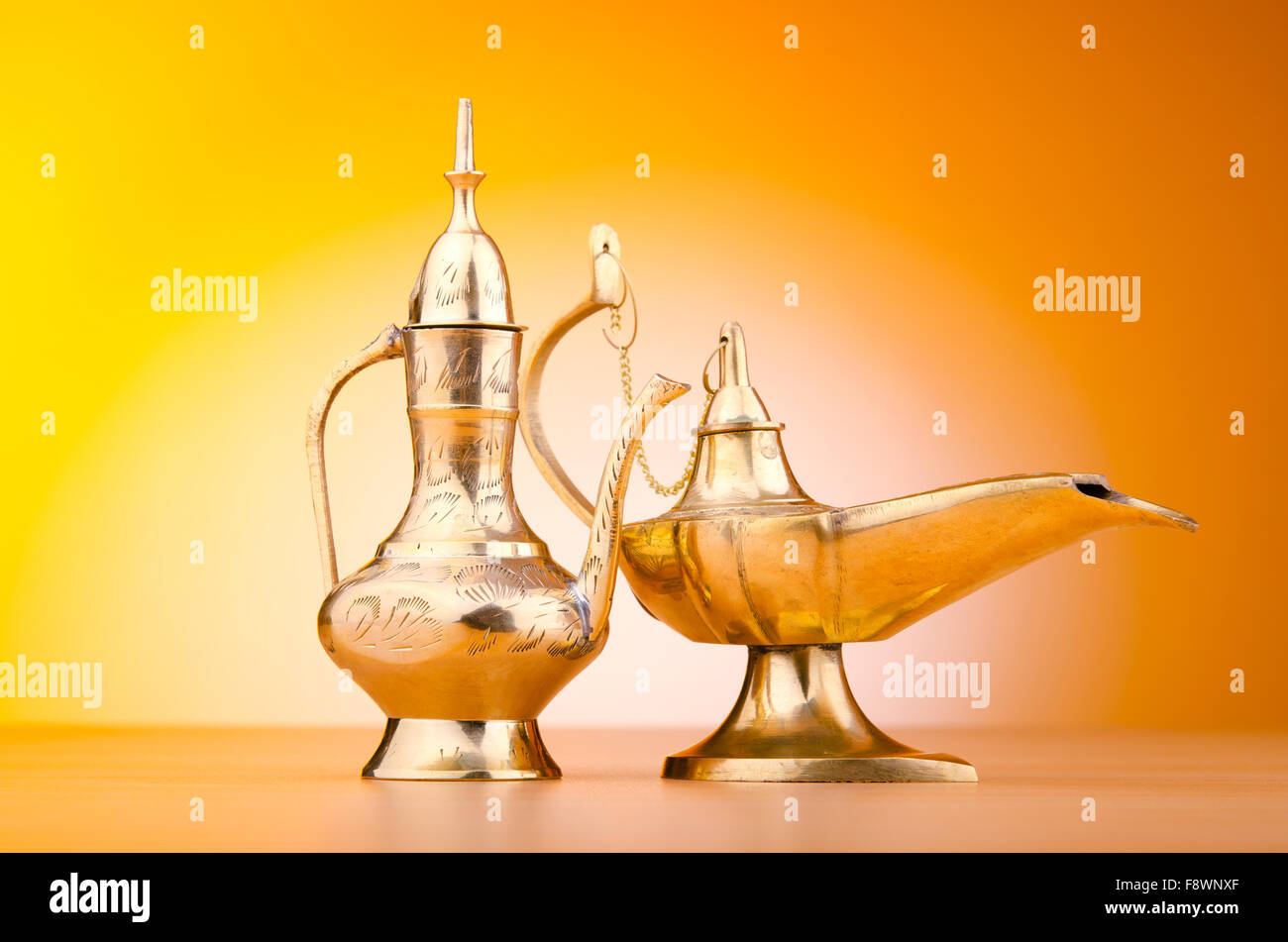 Ancient lamp against gradient background Stock Photo - Alamy