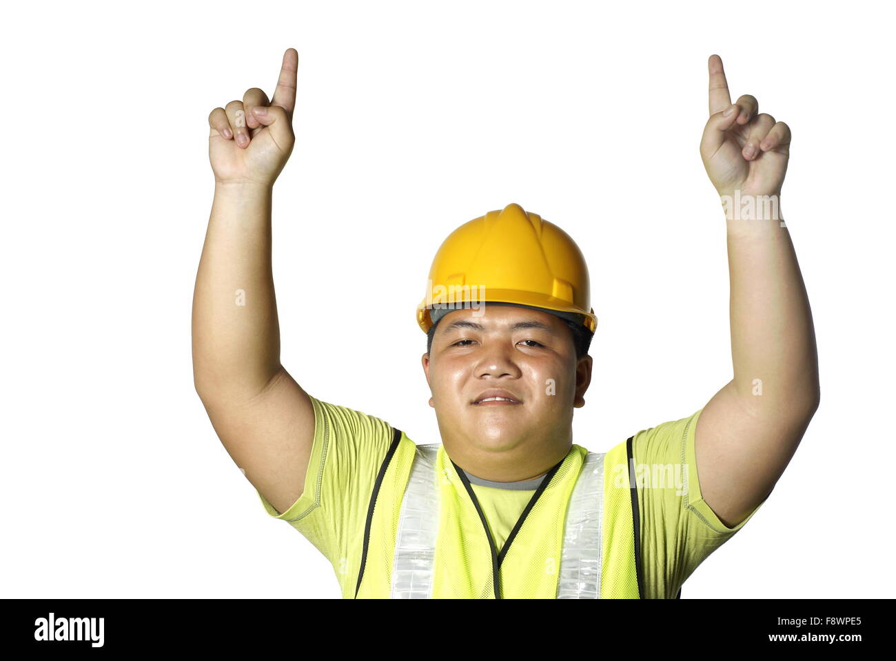 Asian construction worker pointing up with white copy space Stock Photo ...