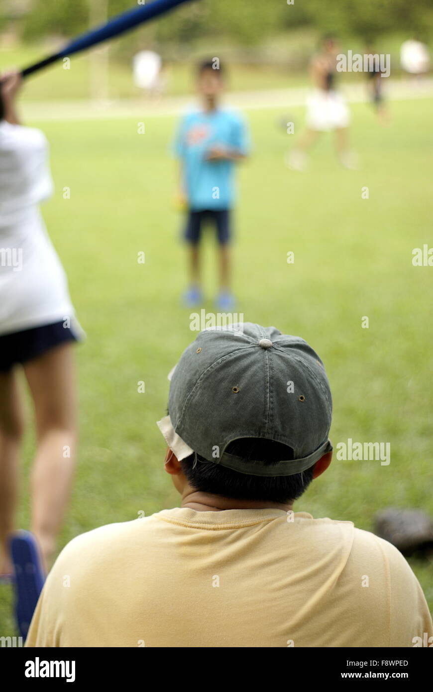 Family playing softball together, focus on father wearing cap Stock ...