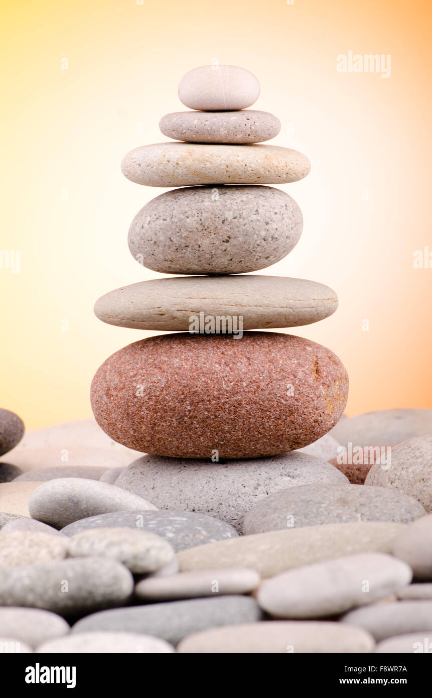 Pebbles stack against gradient background Stock Photo - Alamy