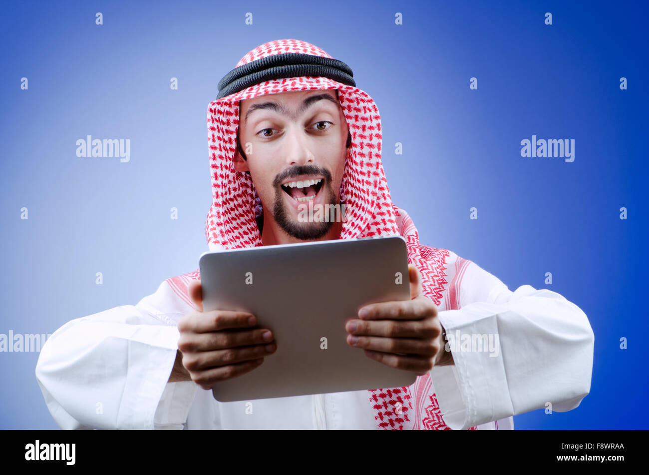 Young arab with tablet computer Stock Photo - Alamy