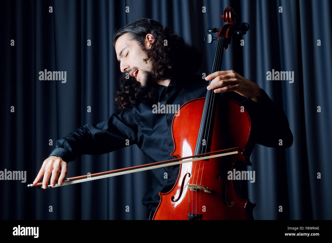Cello player during performance Stock Photo - Alamy