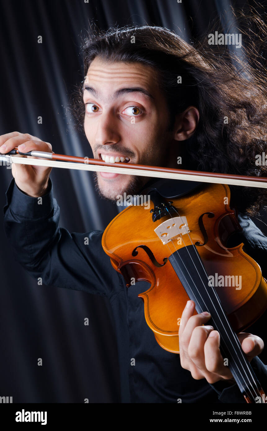 Young violin player playing Stock Photo - Alamy