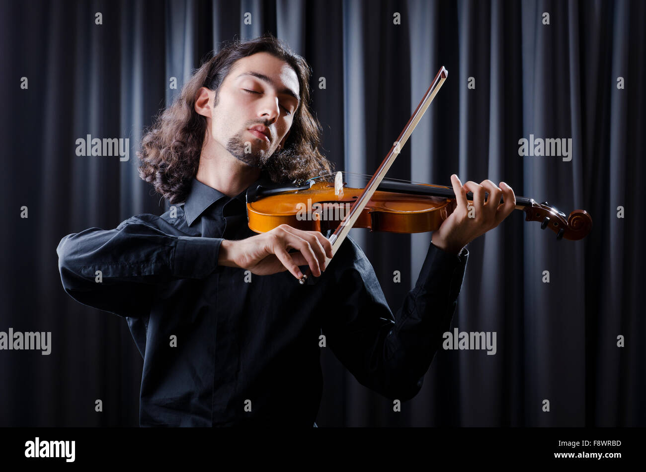 Young violin player playing Stock Photo - Alamy