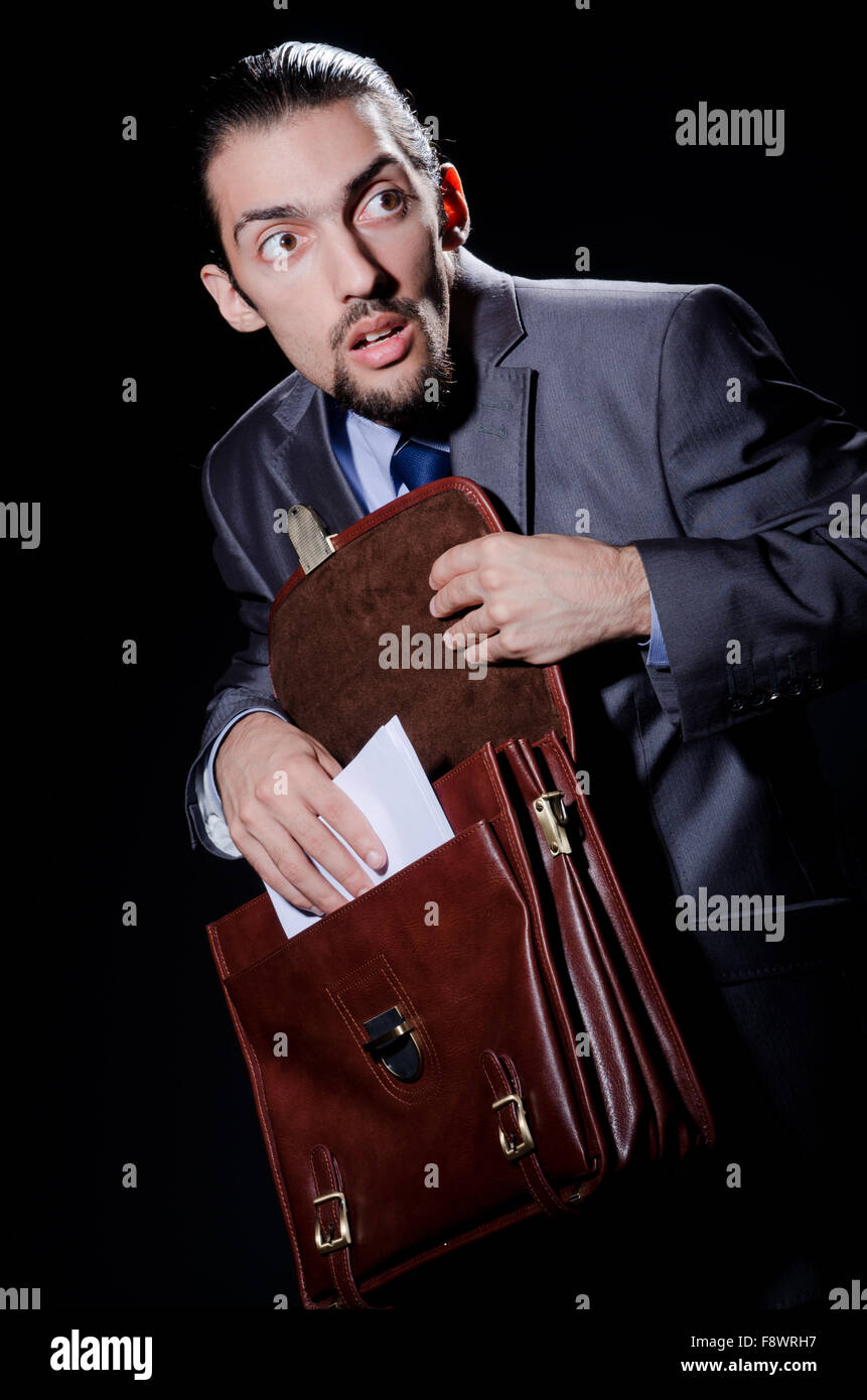 Business spy with briefcase Stock Photo - Alamy