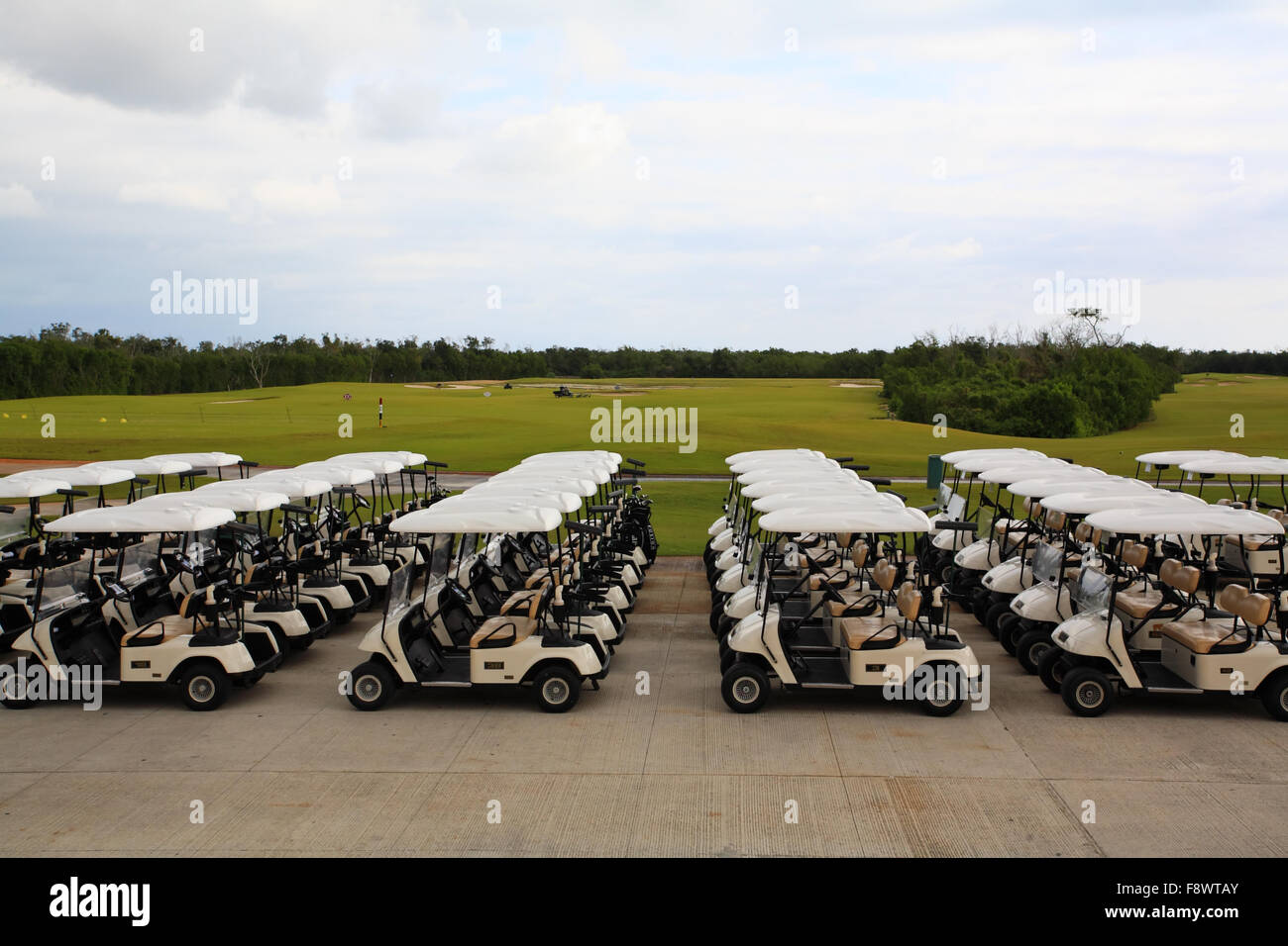 golf carts in a Cancun resort Stock Photo - Alamy