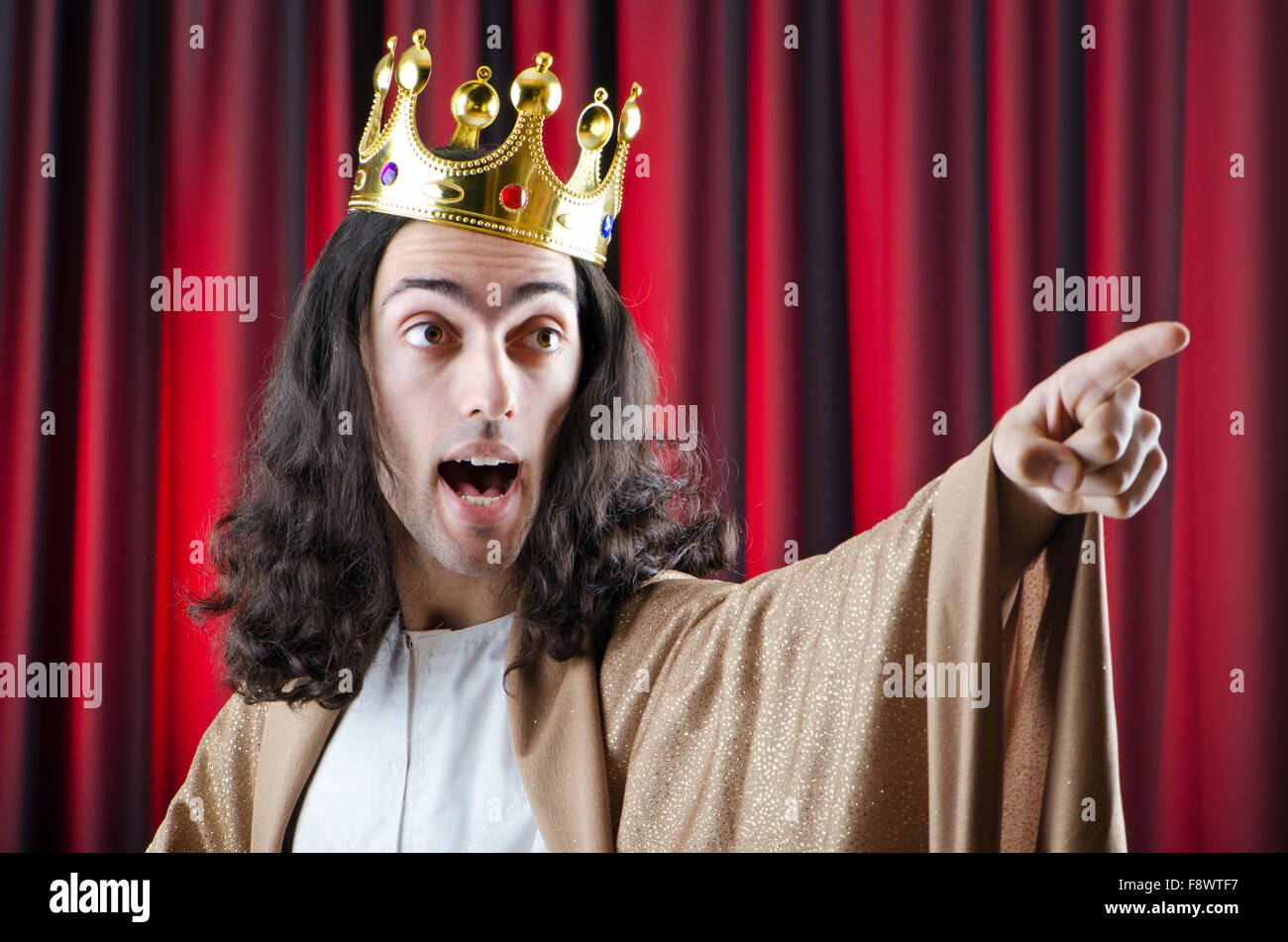 King with crown against background Stock Photo - Alamy