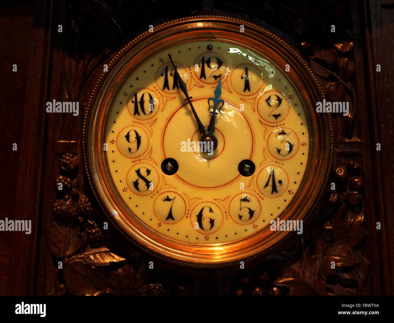 antique circular clock face with fancy hands and numerals and two ...