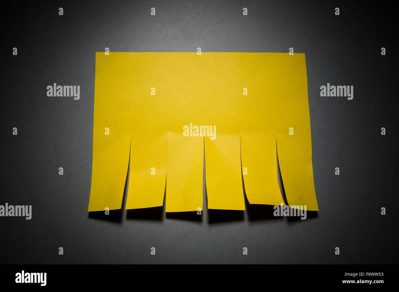 Tear off paper notice on the wall Stock Photo - Alamy