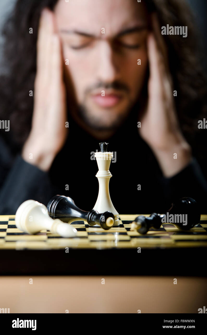 Chess player playing his game Stock Photo - Alamy