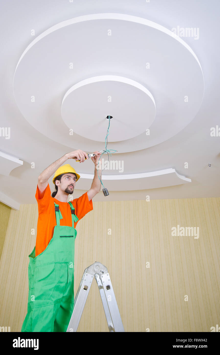 Electrician working on cabling lighting Stock Photo - Alamy