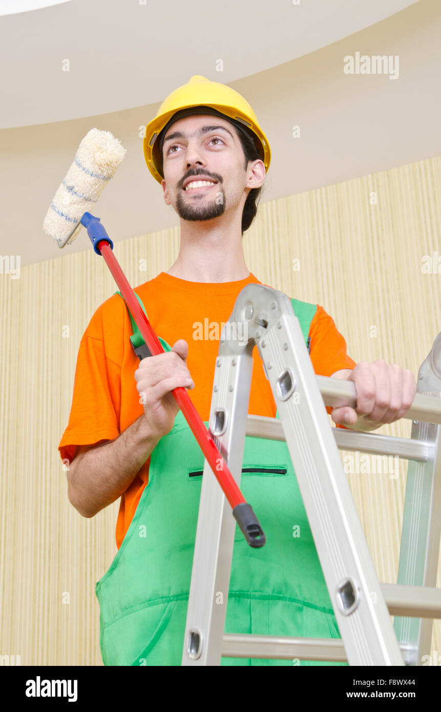 Painter worker during painting job Stock Photo - Alamy