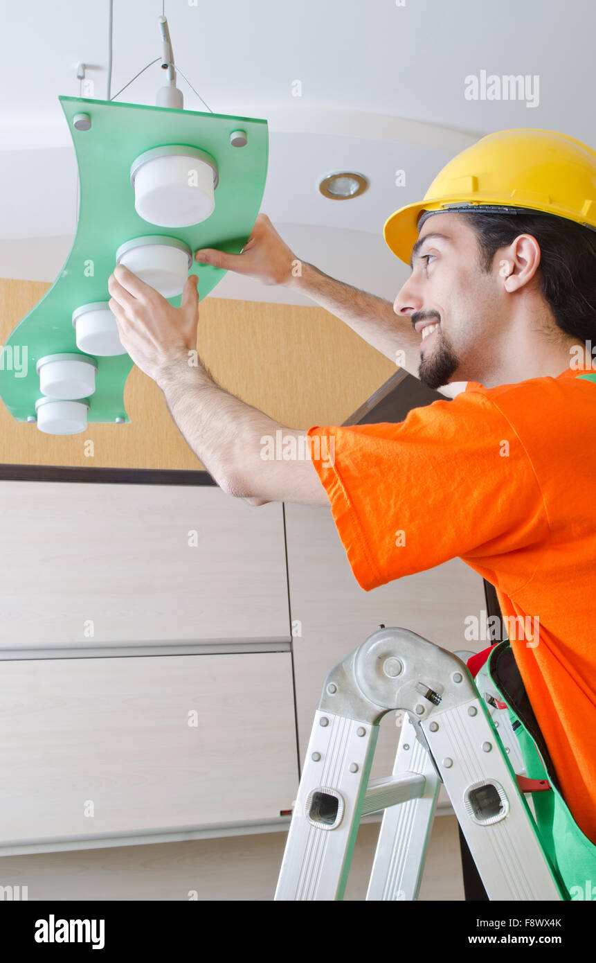 Electrician working on cabling lighting Stock Photo - Alamy