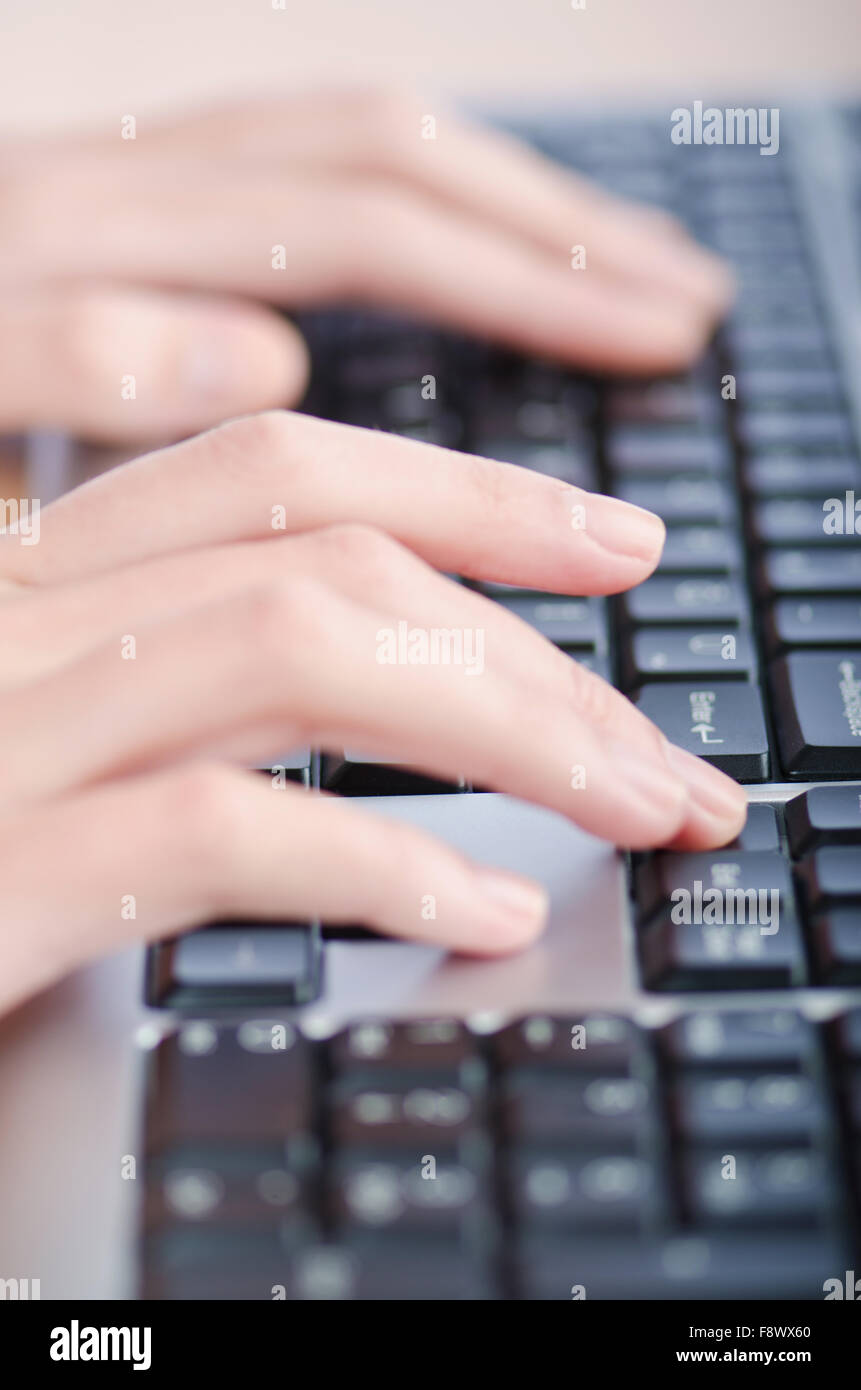 Hands typing on the keyboard Stock Photo - Alamy
