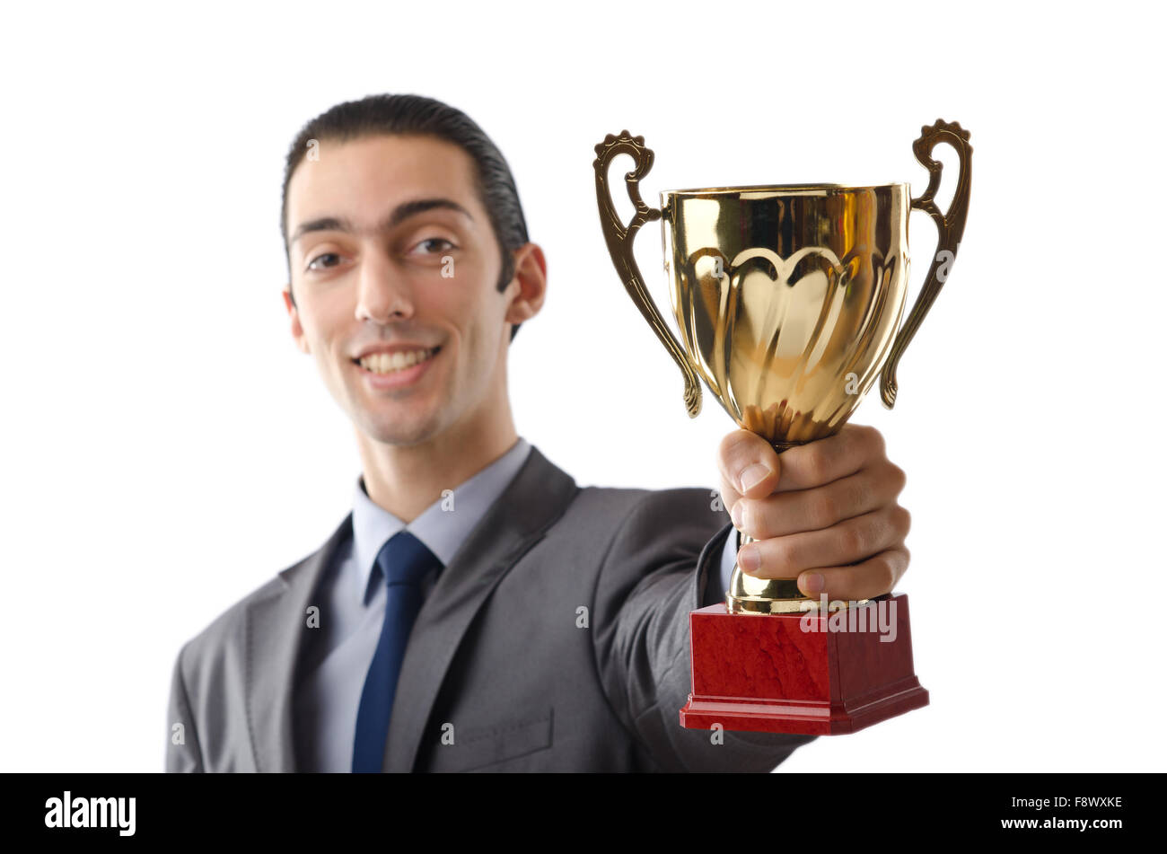 Man being awarded with golden cup Stock Photo - Alamy
