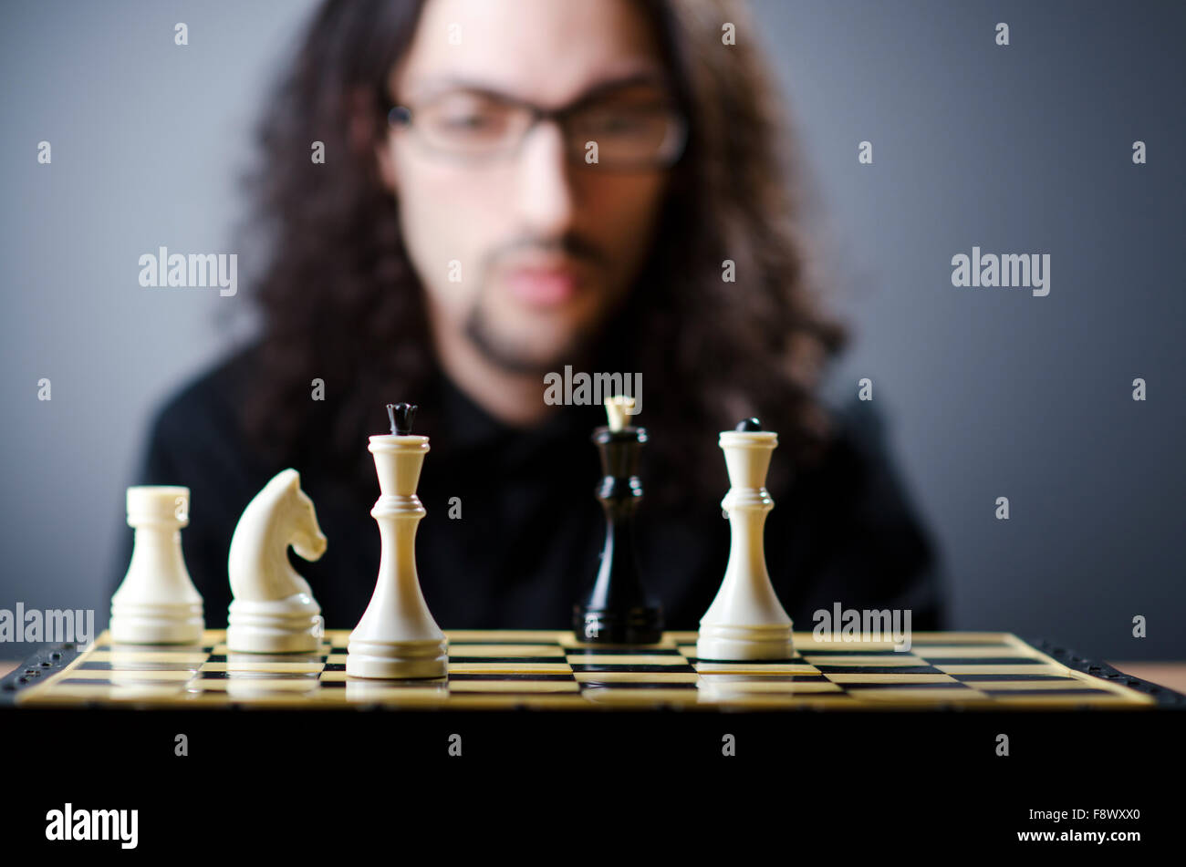 Chess player playing his game Stock Photo - Alamy