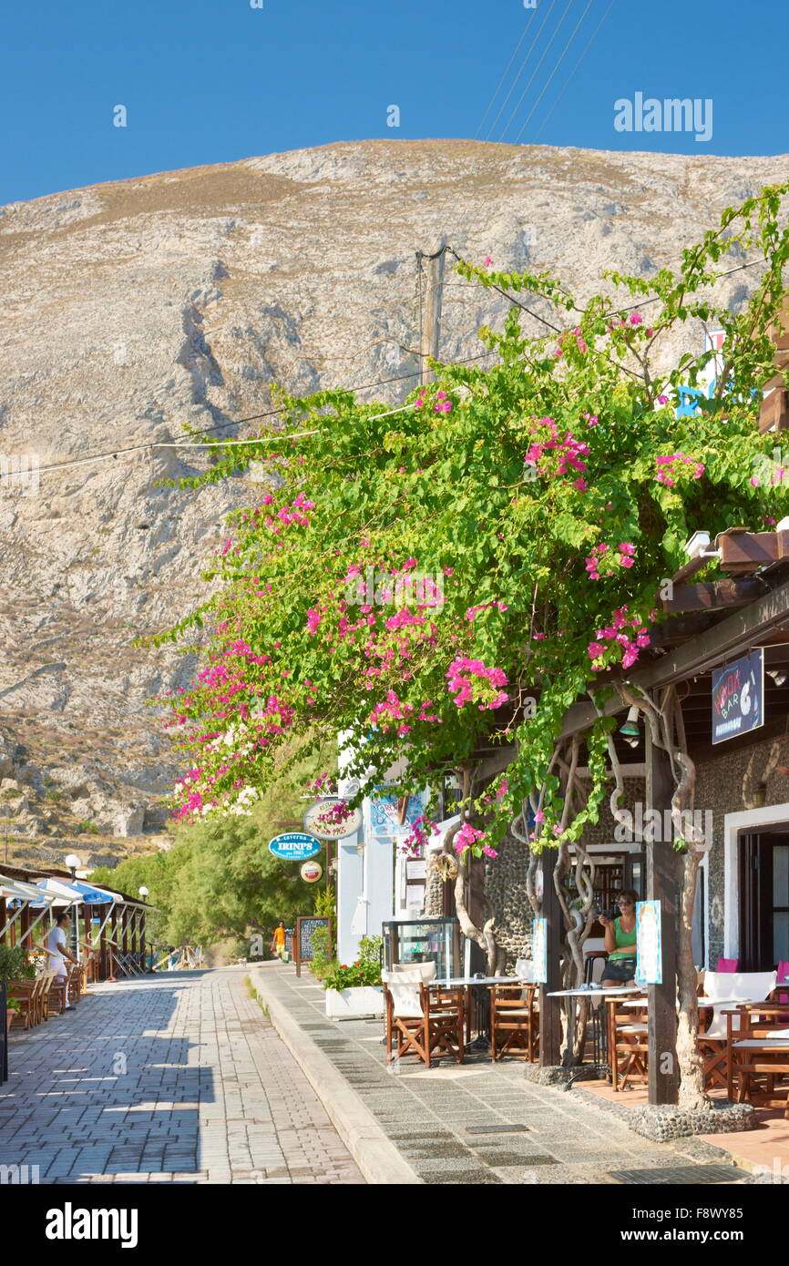 Flowers growing on the houses - Costal Village Kamari, Santorini Island ...