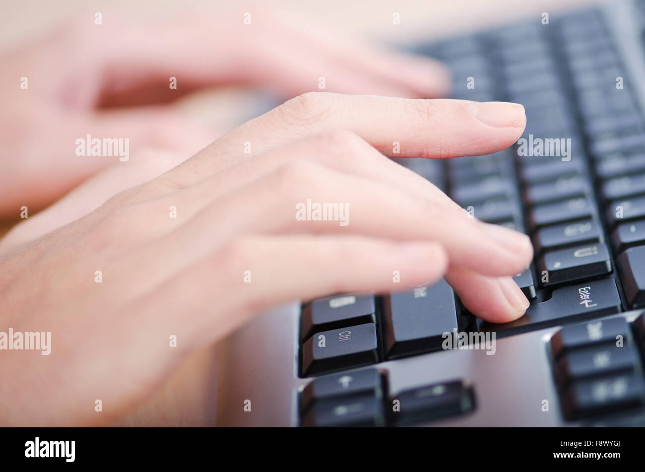 Hands typing on the keyboard Stock Photo - Alamy