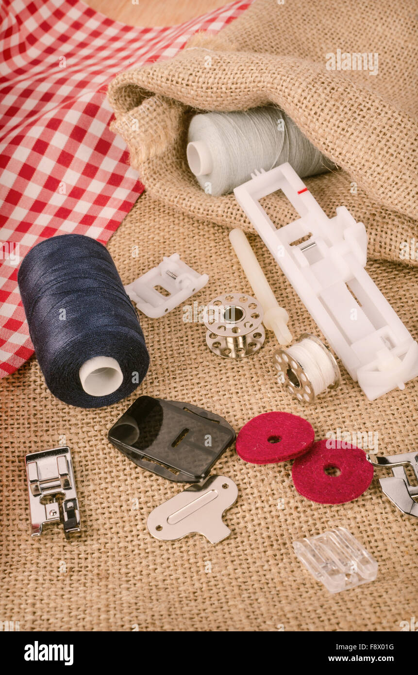 Sewing machine parts in a still life with yarn spools Stock Photo - Alamy