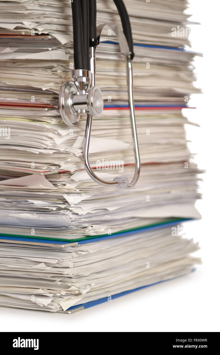 Stack of papers with stethoscope Stock Photo - Alamy