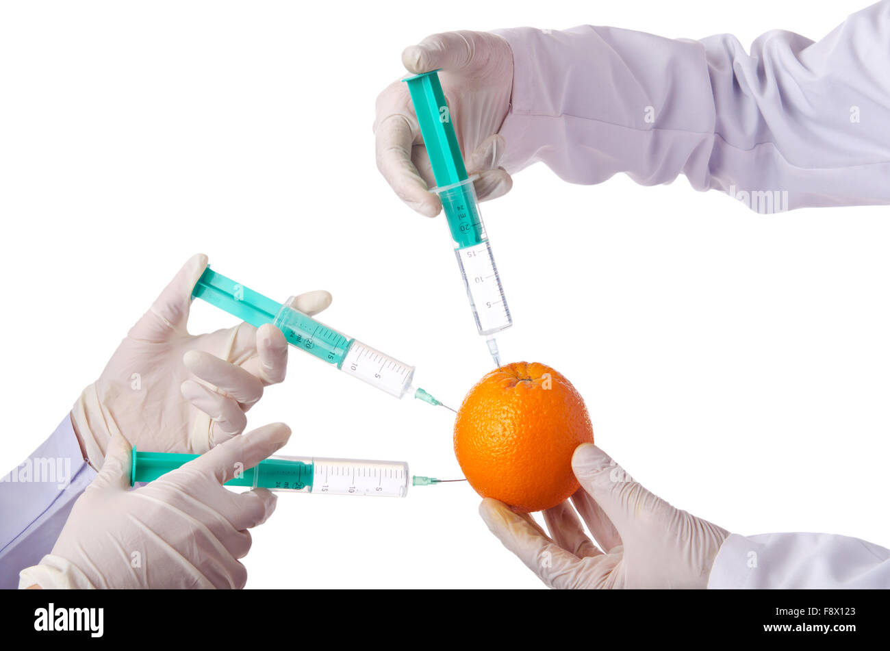 Science experiment with orange and syringe Stock Photo - Alamy