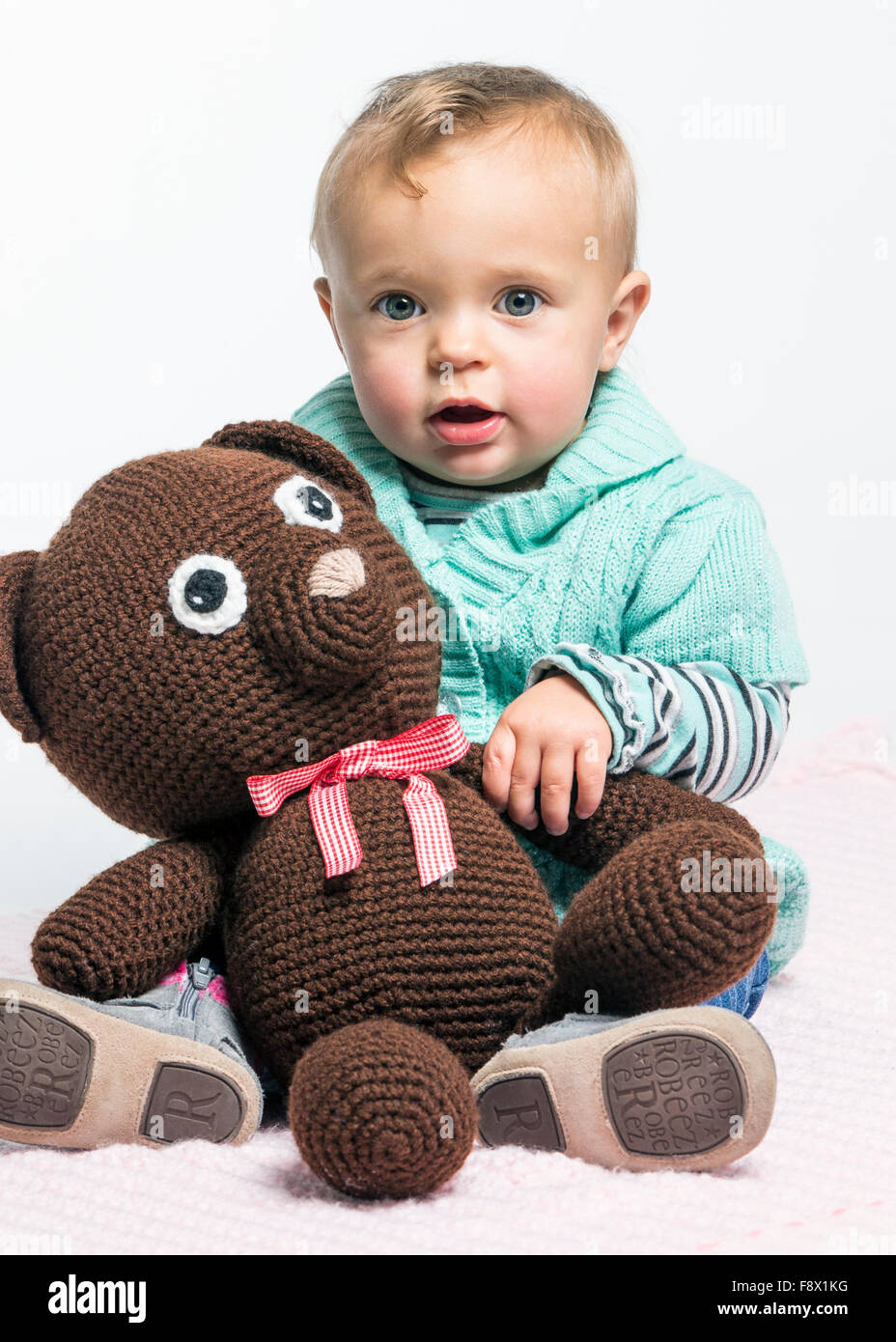 Studio photograph of cute smiling one year old baby girl Stock Photo ...