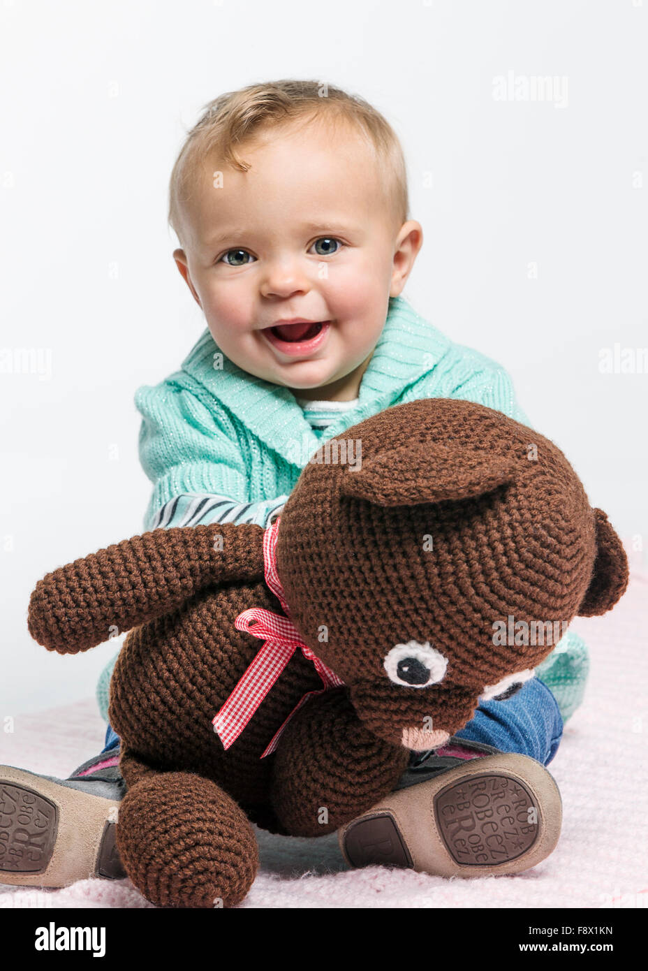 Studio photograph of cute smiling one year old baby girl Stock Photo ...